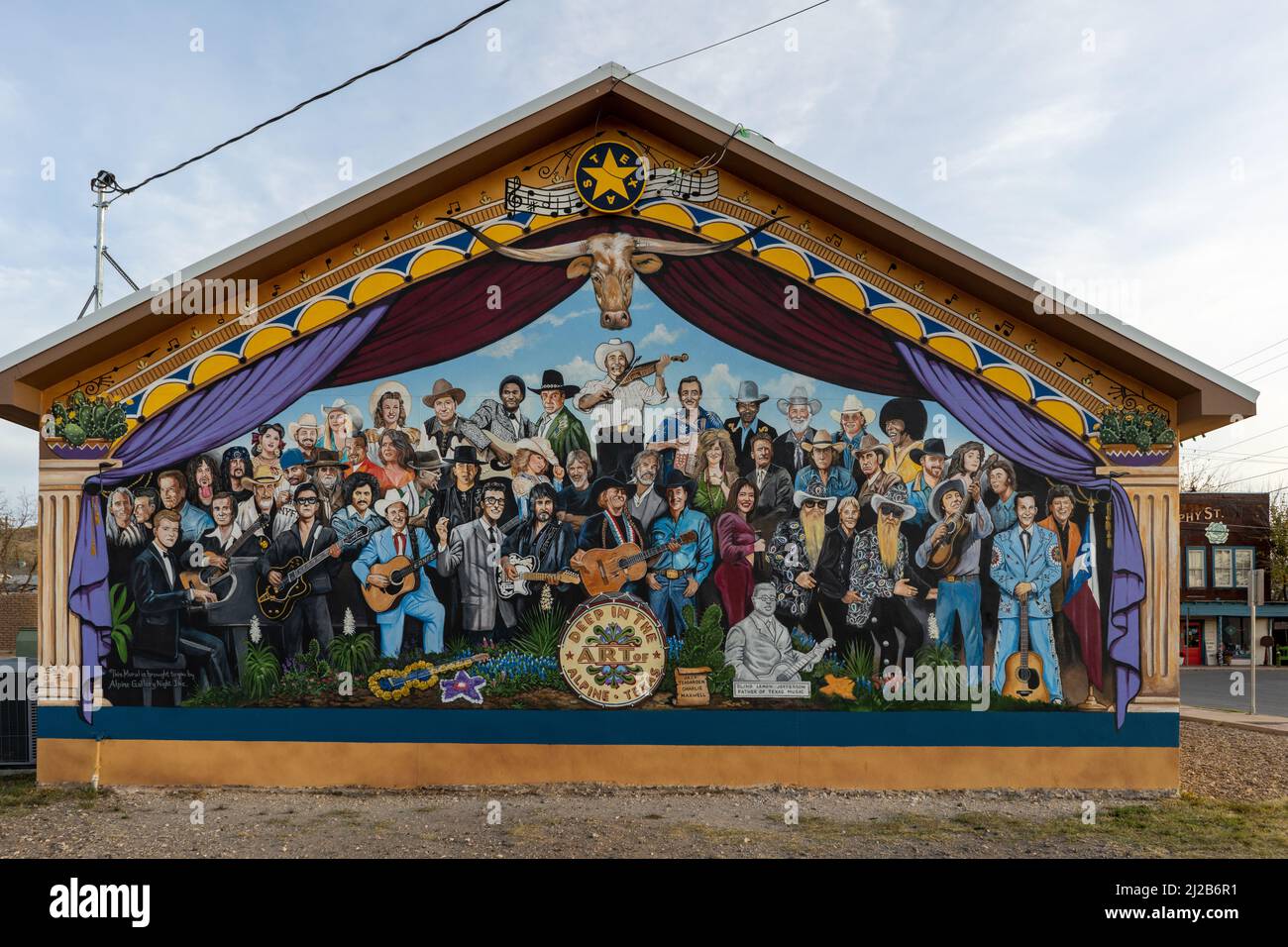 A wonderful mural of a collection of county singers is painted on the ...