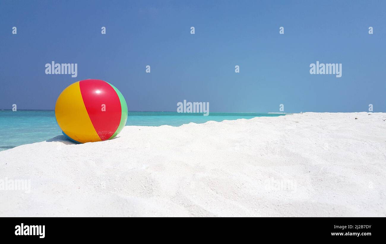 A beautiful shot of a colorful ball at a beach near the Indian Ocean in ...