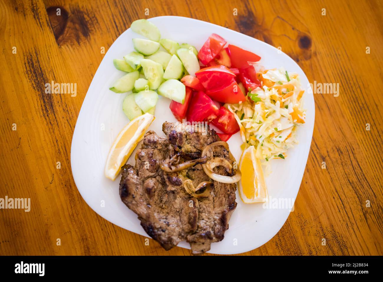 Delicious colorful local food pork steak in a restaurant. Traditional ...