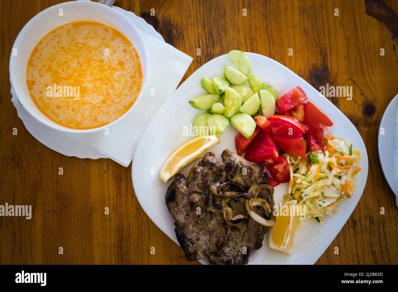 Delicious colorful local food pork steak in a restaurant. Traditional ...