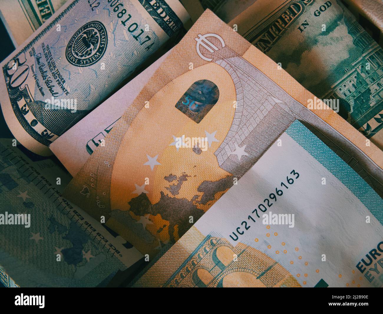 Cash banknotes dollars and euros are mixed up, a close-up shot Stock ...