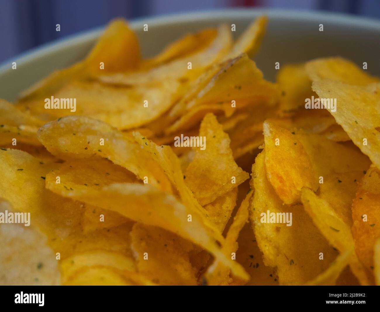A bowl of potato chips. A close-up shot Stock Photo - Alamy