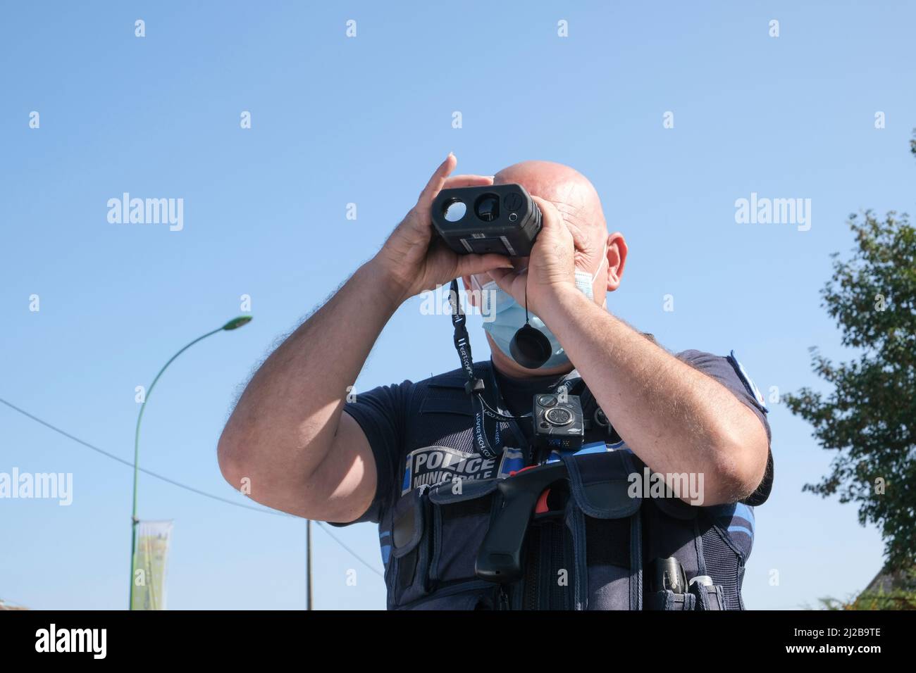 Local police: speed check with a laser speed measuring device Stock ...