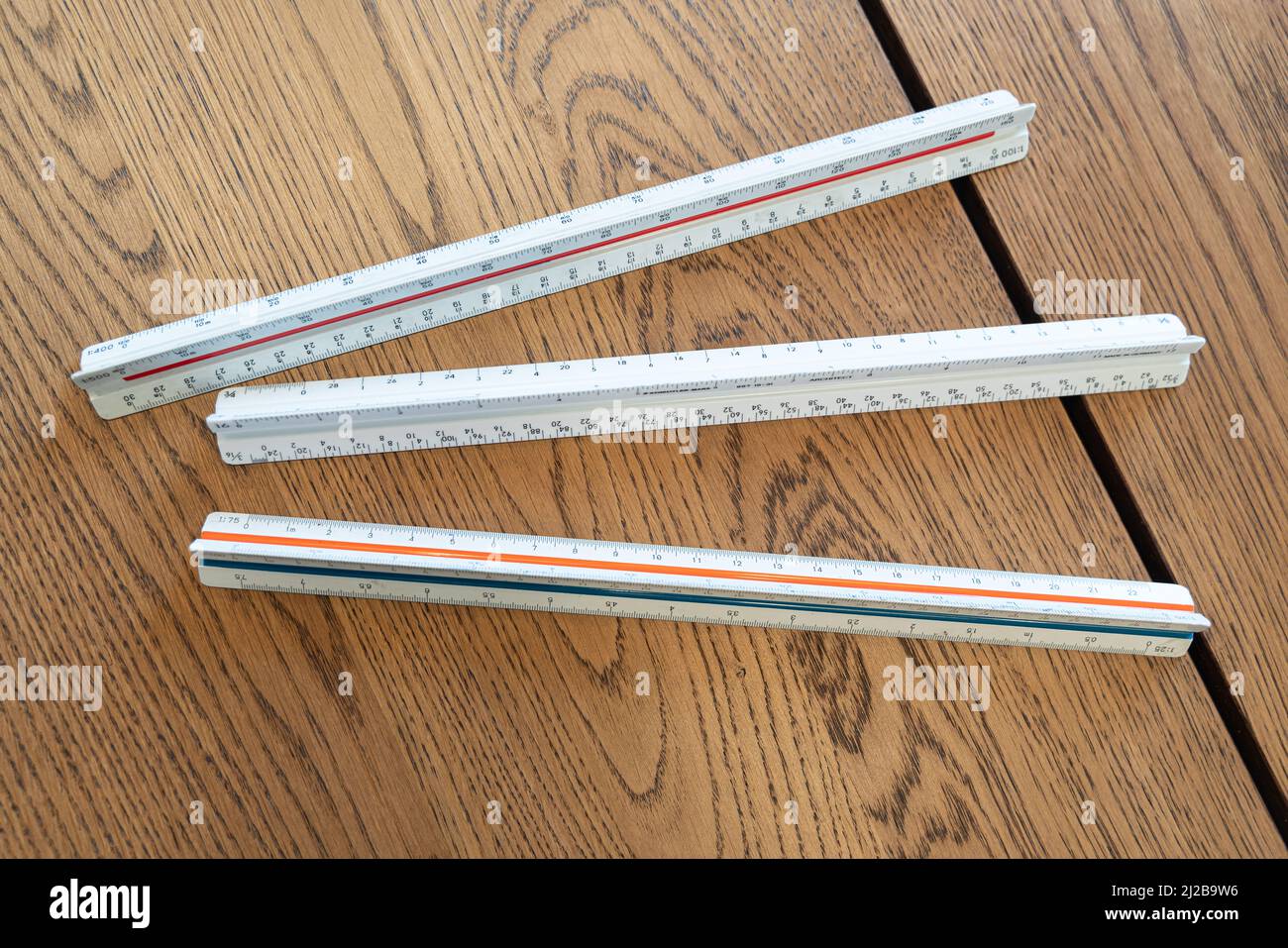 Architectural Scale Ruler with paper blueprints plans for new building ...