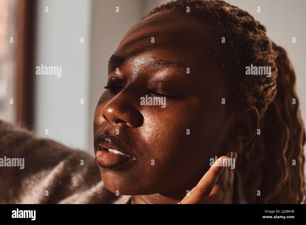 African woman face ear hi-res stock photography and images - Alamy