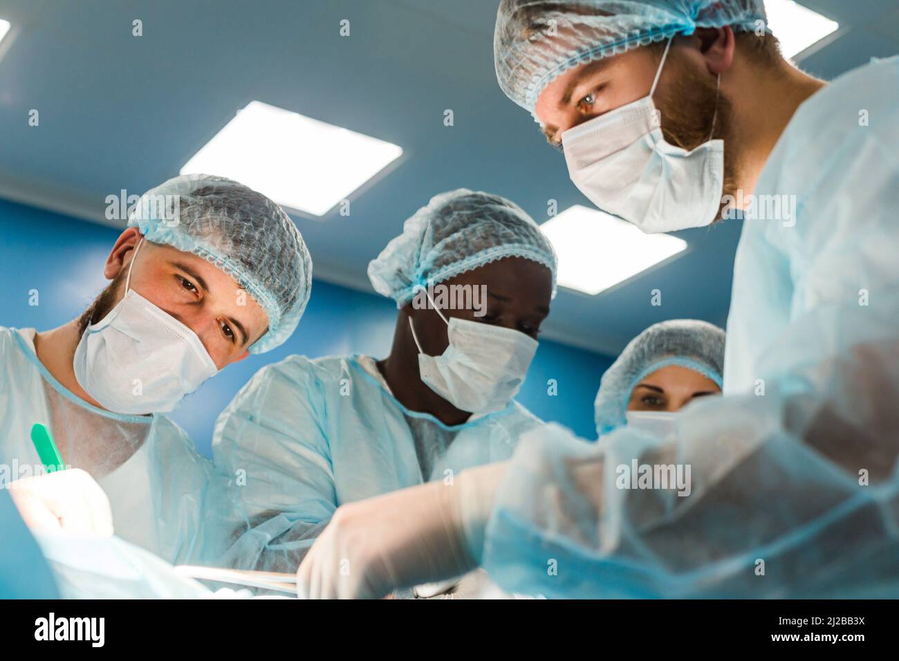 The senior surgeon in the operating room, where the patient is waiting ...