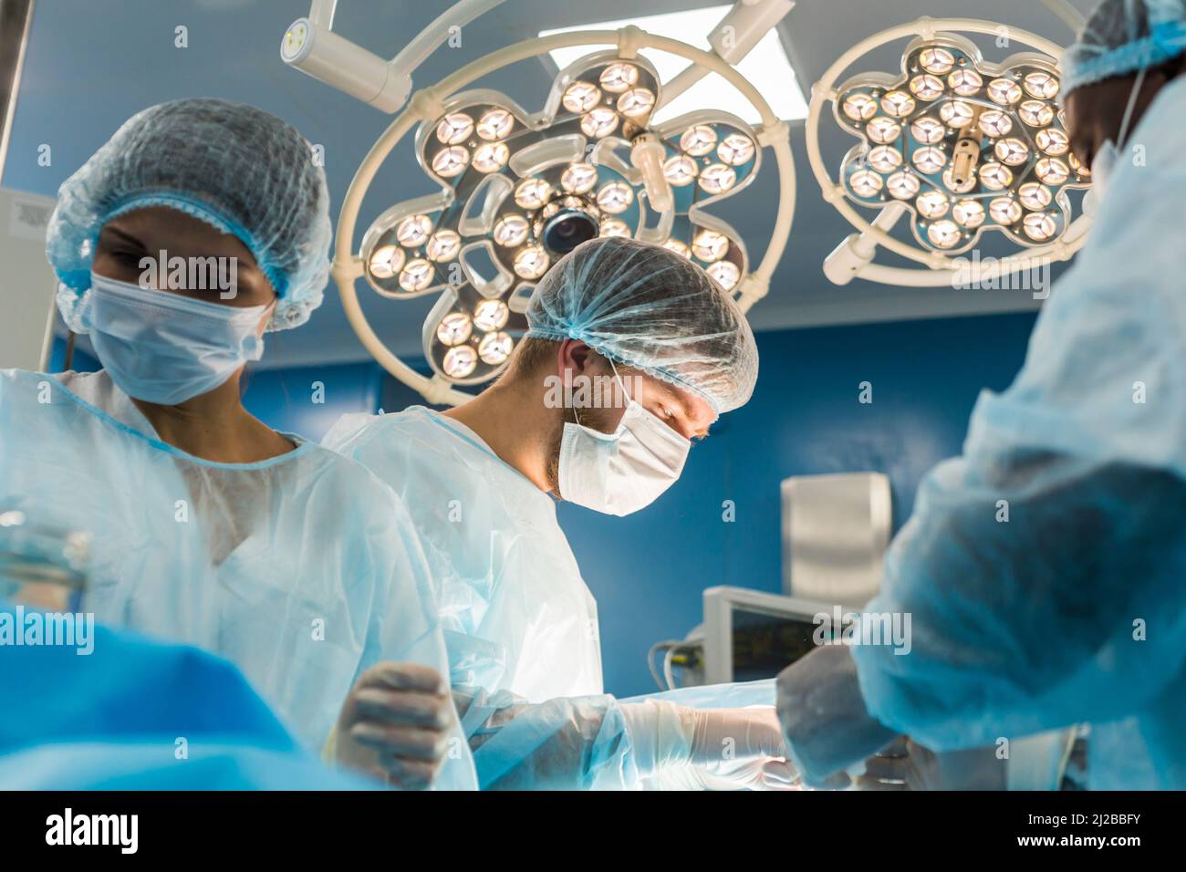 The senior surgeon in the operating room, where the patient is waiting ...