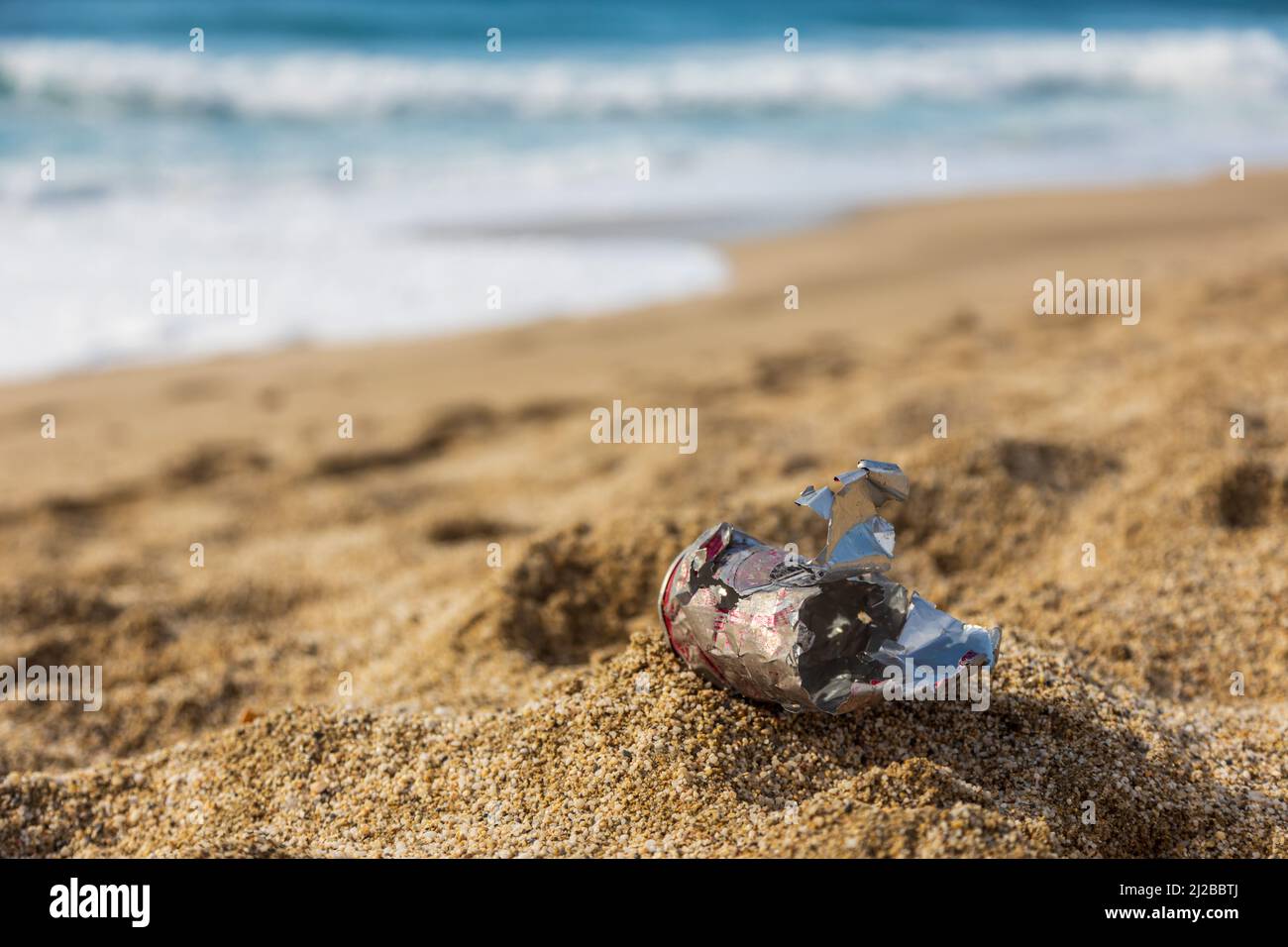 Pollution of the planet with human waste. An empty tin can thrown away ...