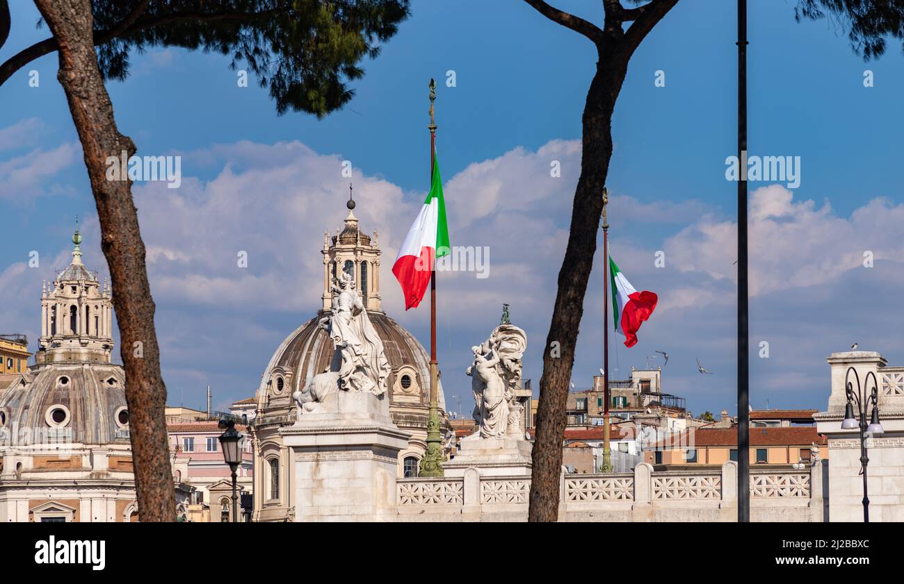 A picture of two Italian flags next to some landmarks as seen through ...