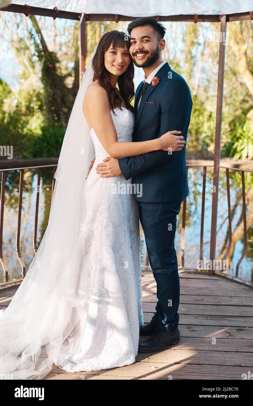 We finally tied the knot. Shot of a young couple standing together on ...
