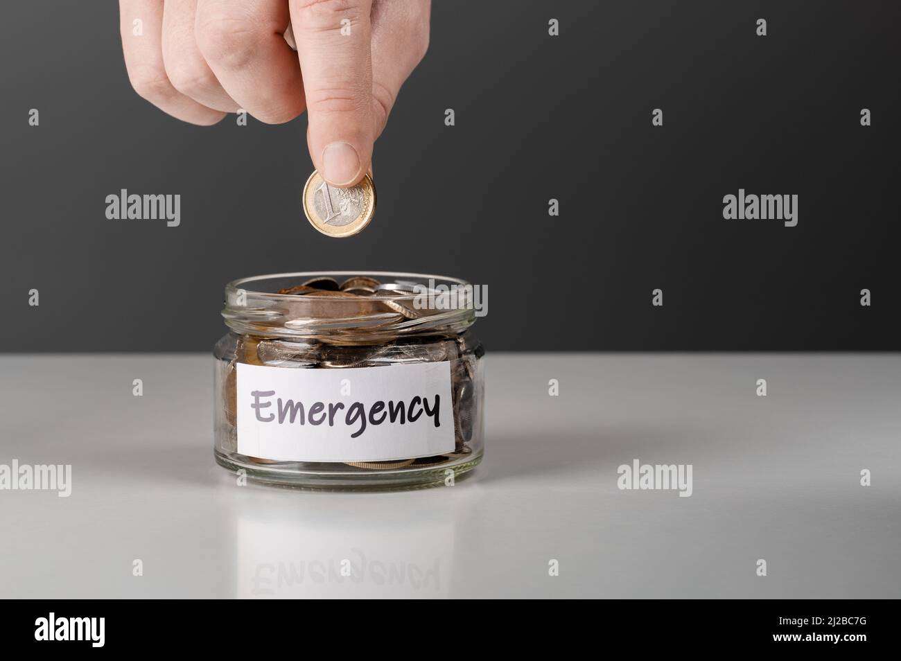 Hand holding money putting glass hi-res stock photography and images ...