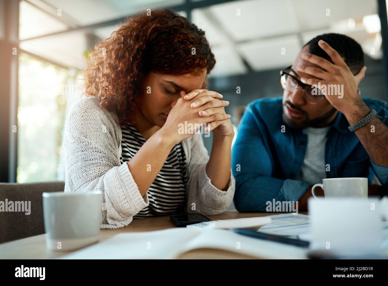 It feels like were starting to drown in debt. Shot of a young couple ...