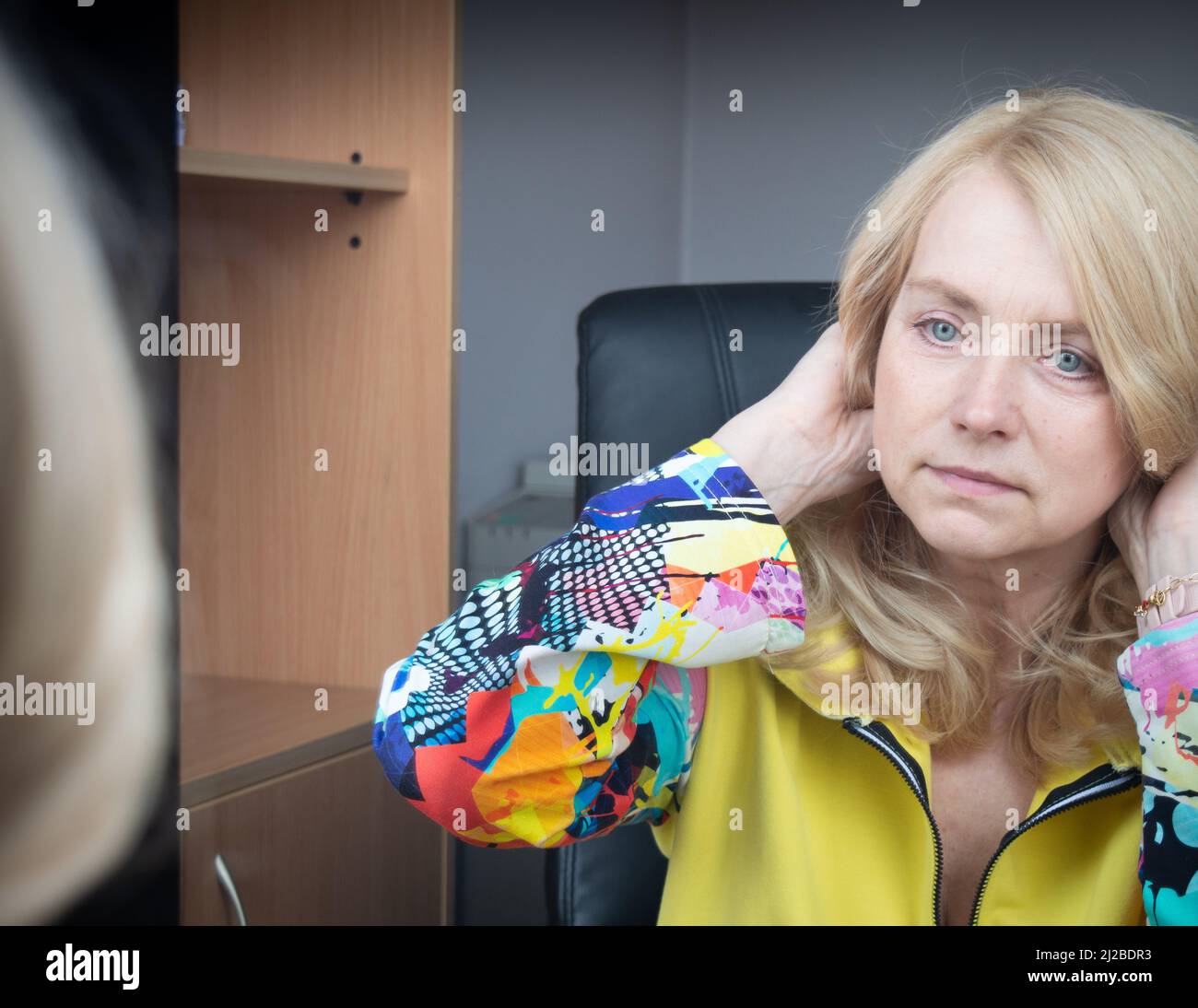 Woman looking at her own reflection Stock Photo - Alamy