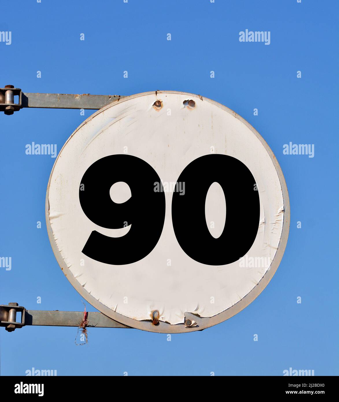 A speed limit sign with number 90 added on it Stock Photo - Alamy