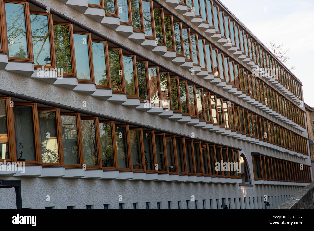 Window facade with protruding triangular windows Stock Photo - Alamy