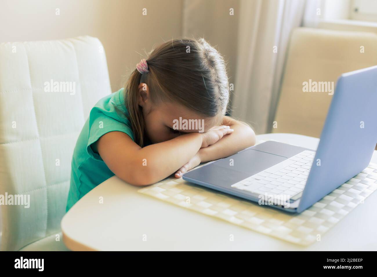 Little cute girl uses laptop to have video call Stock Photo - Alamy