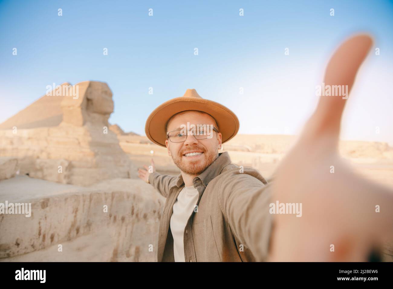 Travel Selfie photo man in hat background pyramid of Egyptian Giza and ...