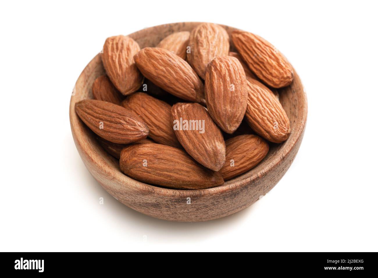 Almonds in small wooden shell isolated Stock Photo - Alamy