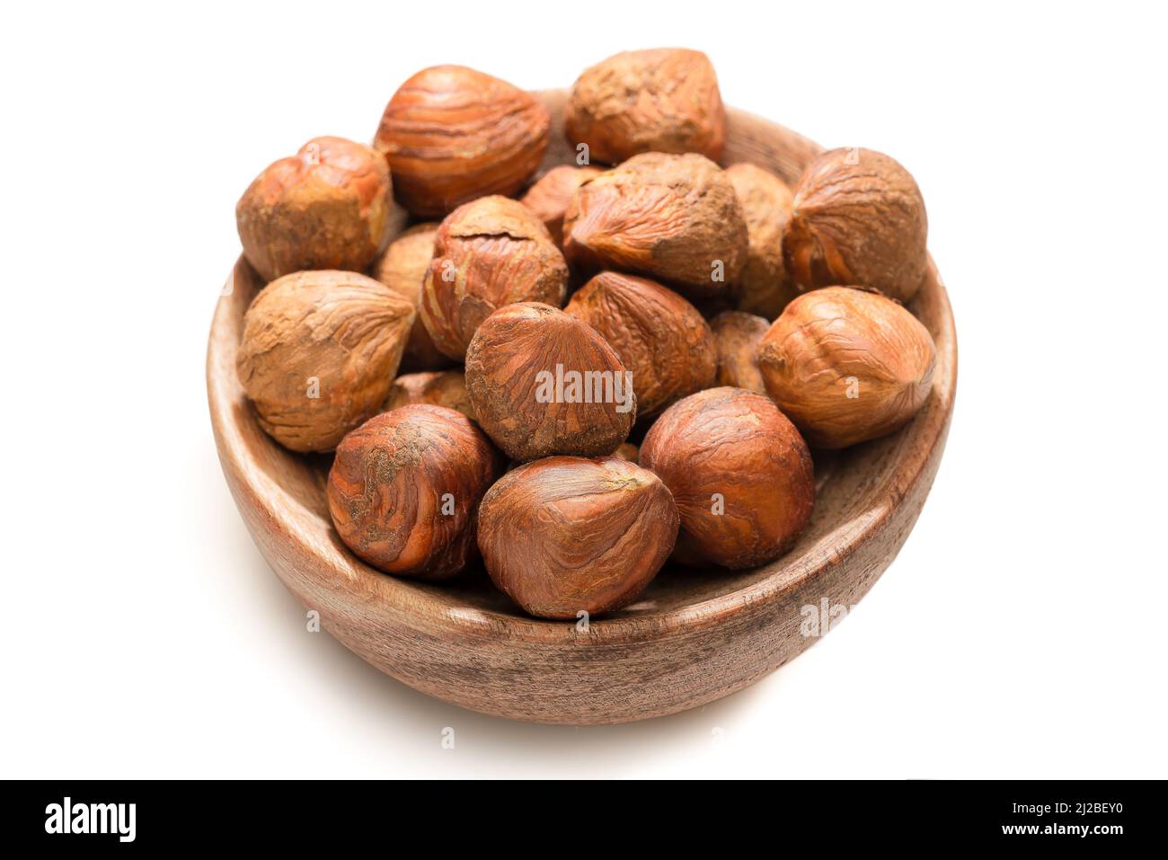 Hazelnuts in a small wooden shell isolated Stock Photo - Alamy