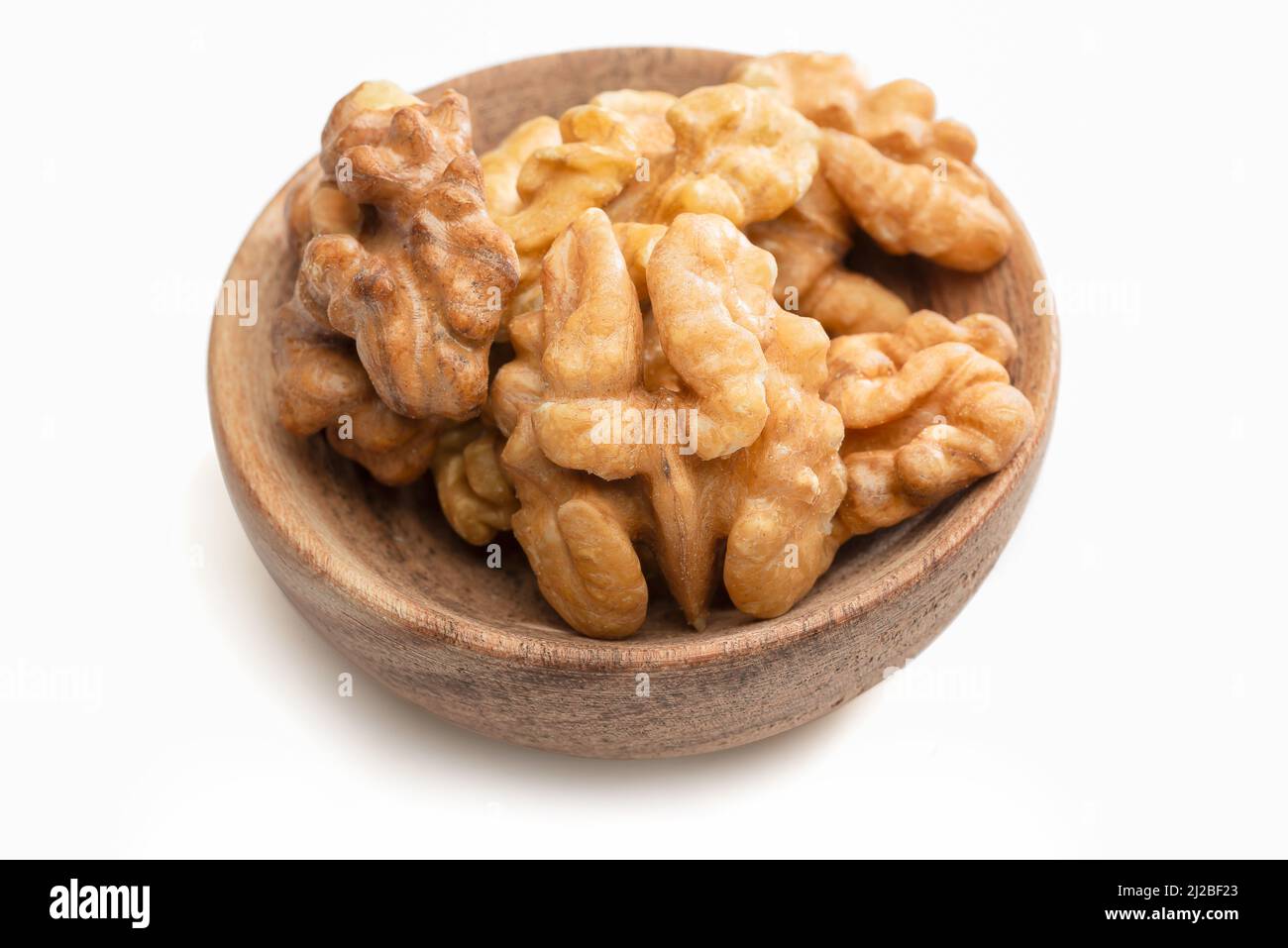 Walnuts in small wooden shell isolated Stock Photo - Alamy