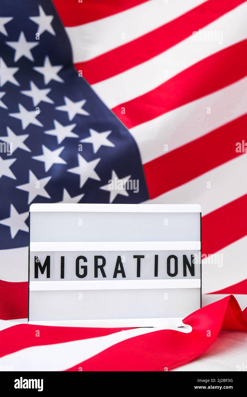 American flag. Lightbox with text MIGRATION Flag of the united states ...