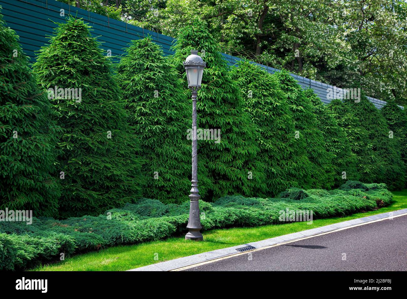 roadside of asphalt road with drainage concrete canal and ditch with ...