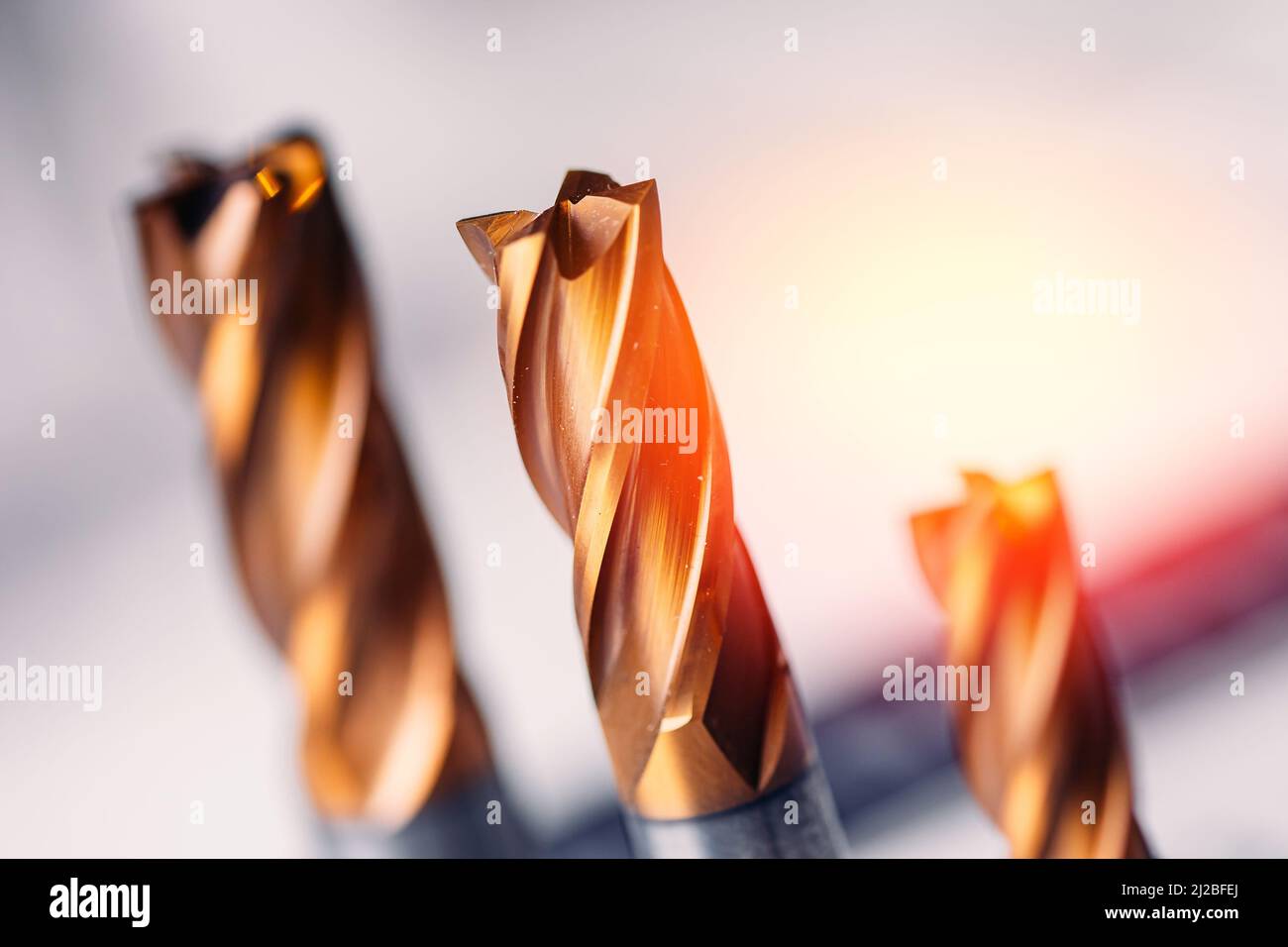 Closeup drill bit set for CNC machine cutting sheet metal with sunlight ...