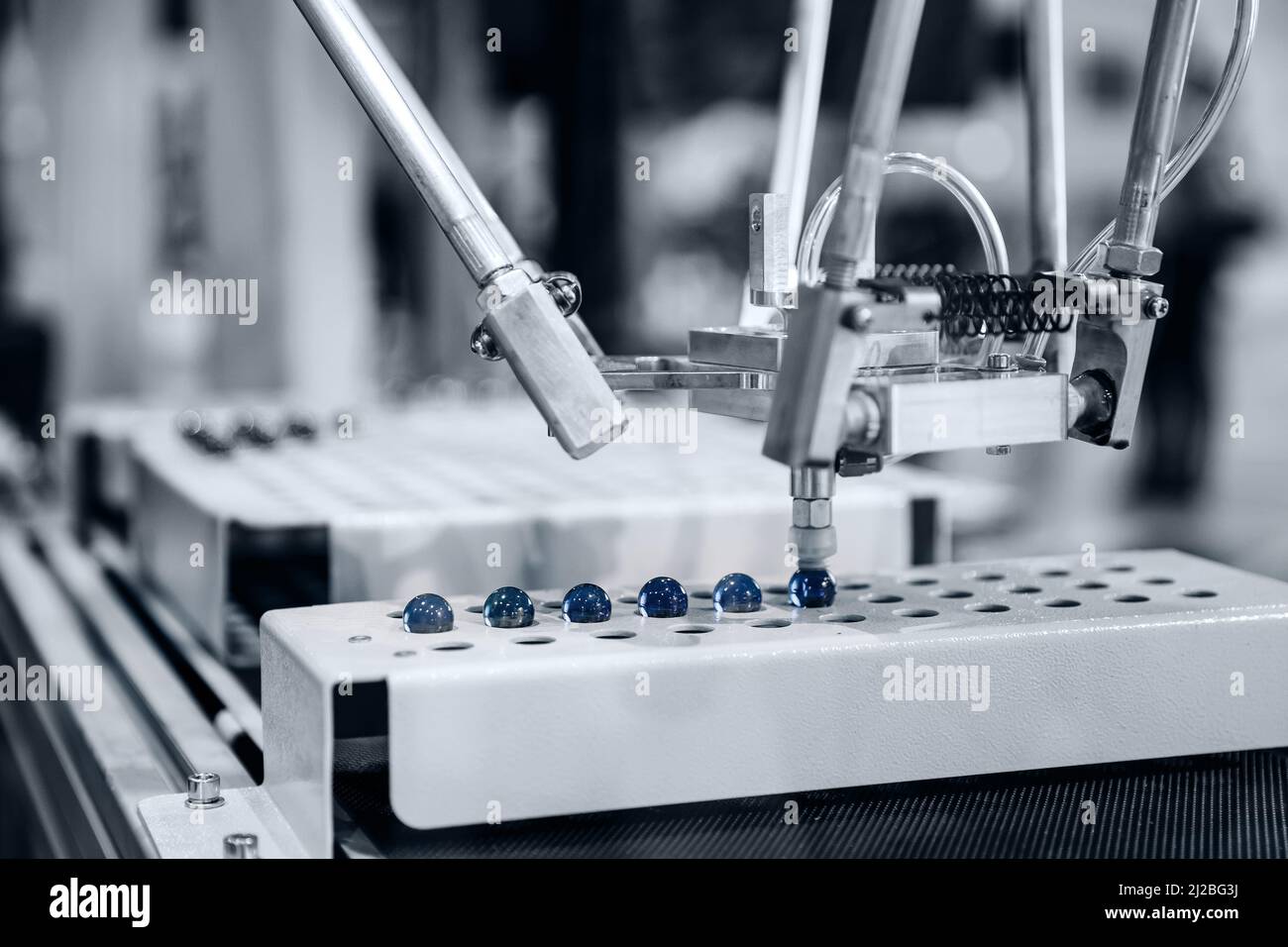 Automatic arm for moving individual parts in industrial production ...