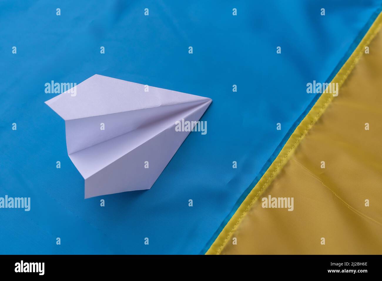 paper airplane on the background of the flag of Ukraine Stock Photo - Alamy