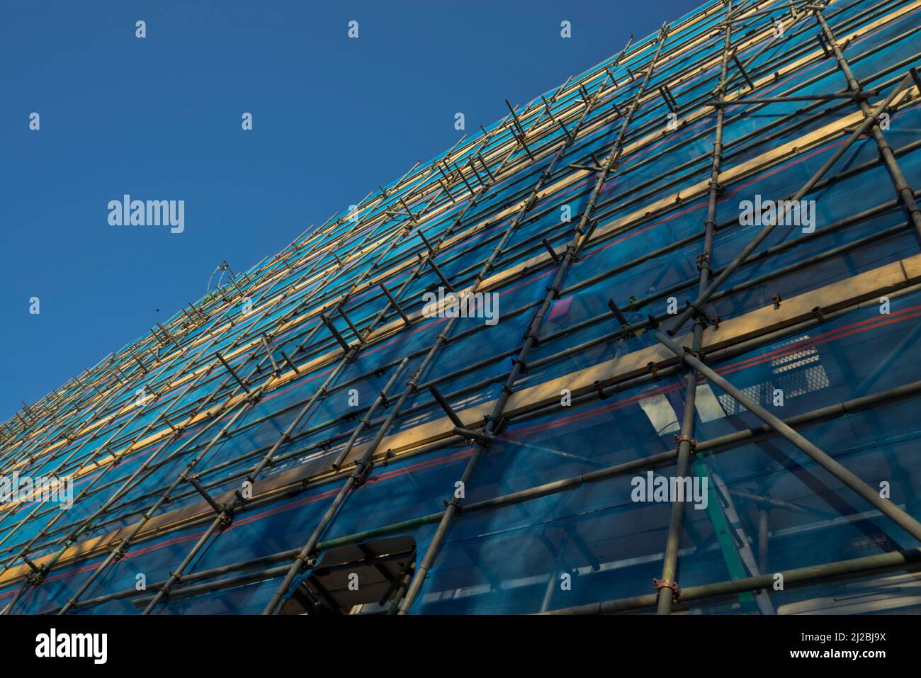 Scaffolding for repairs at a run-down social housing estate in Hackney ...