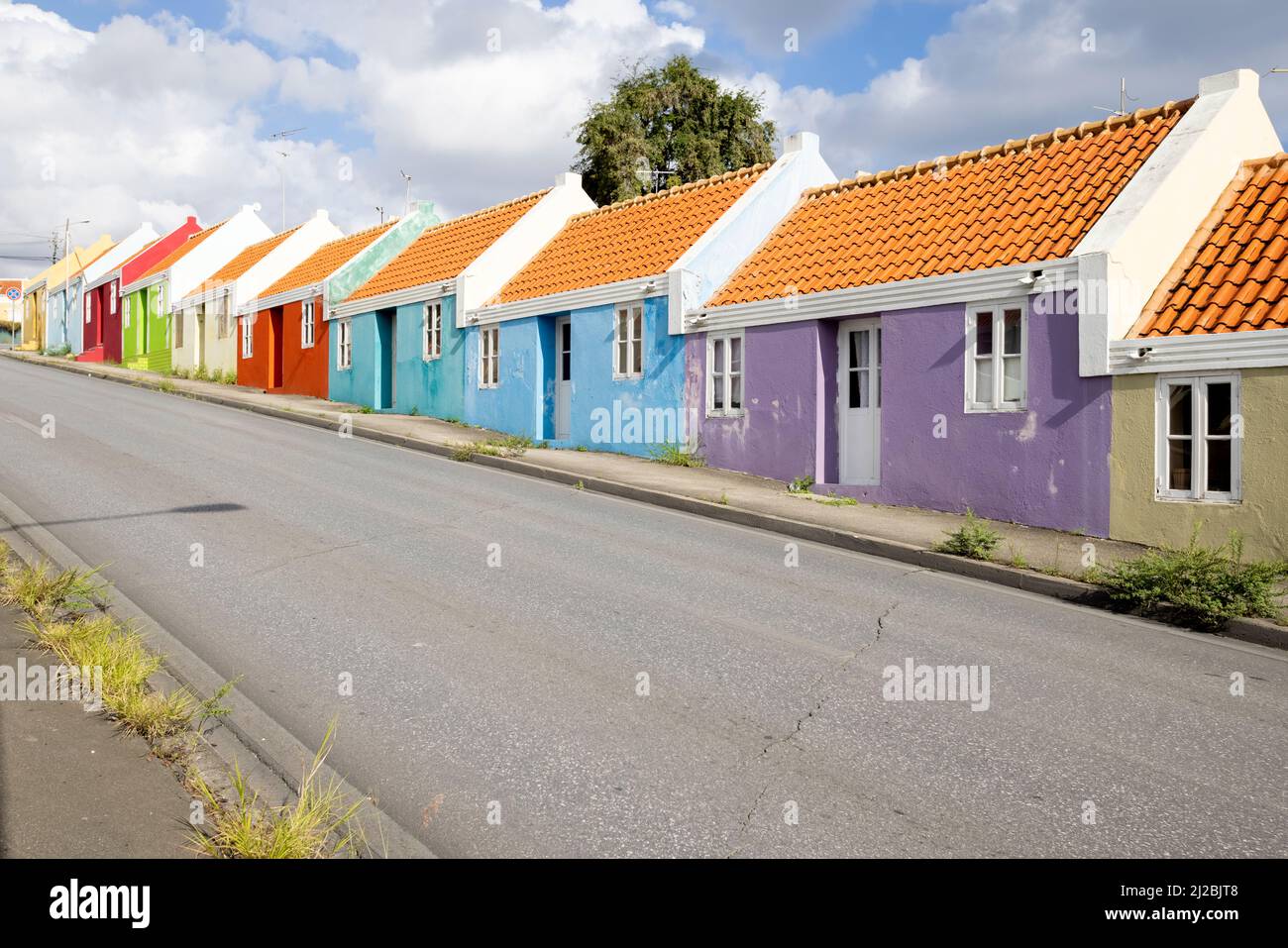 Small colorful houses along the road somewhere in Willemstad, Curacao ...