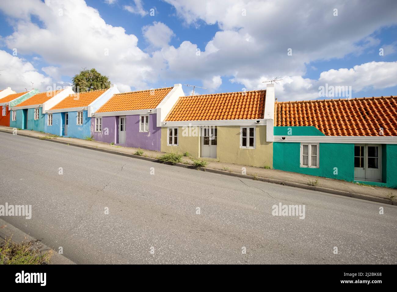 Small colorful houses along the road somewhere in Willemstad, Curacao ...