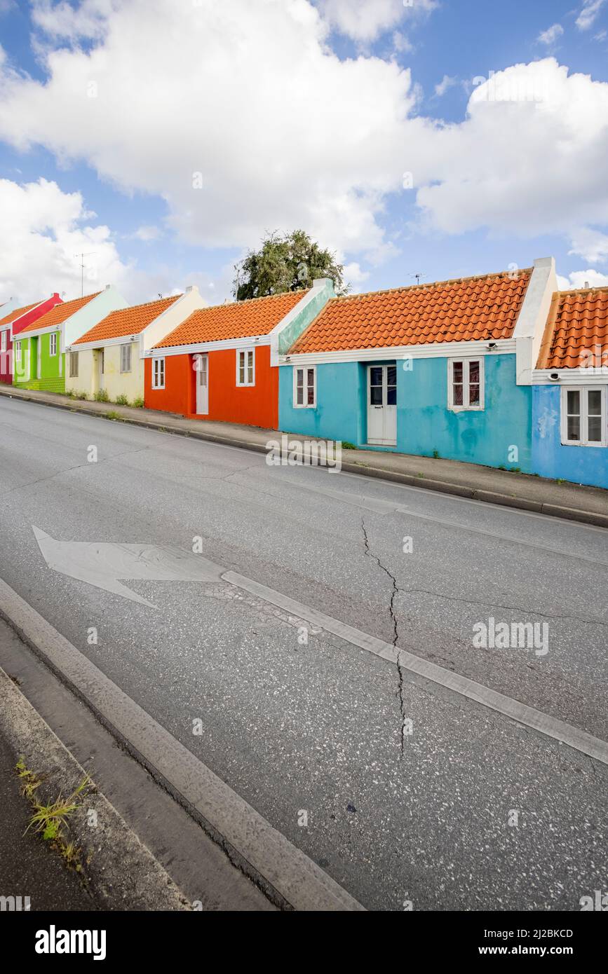Small colorful houses along the road somewhere in Willemstad, Curacao ...