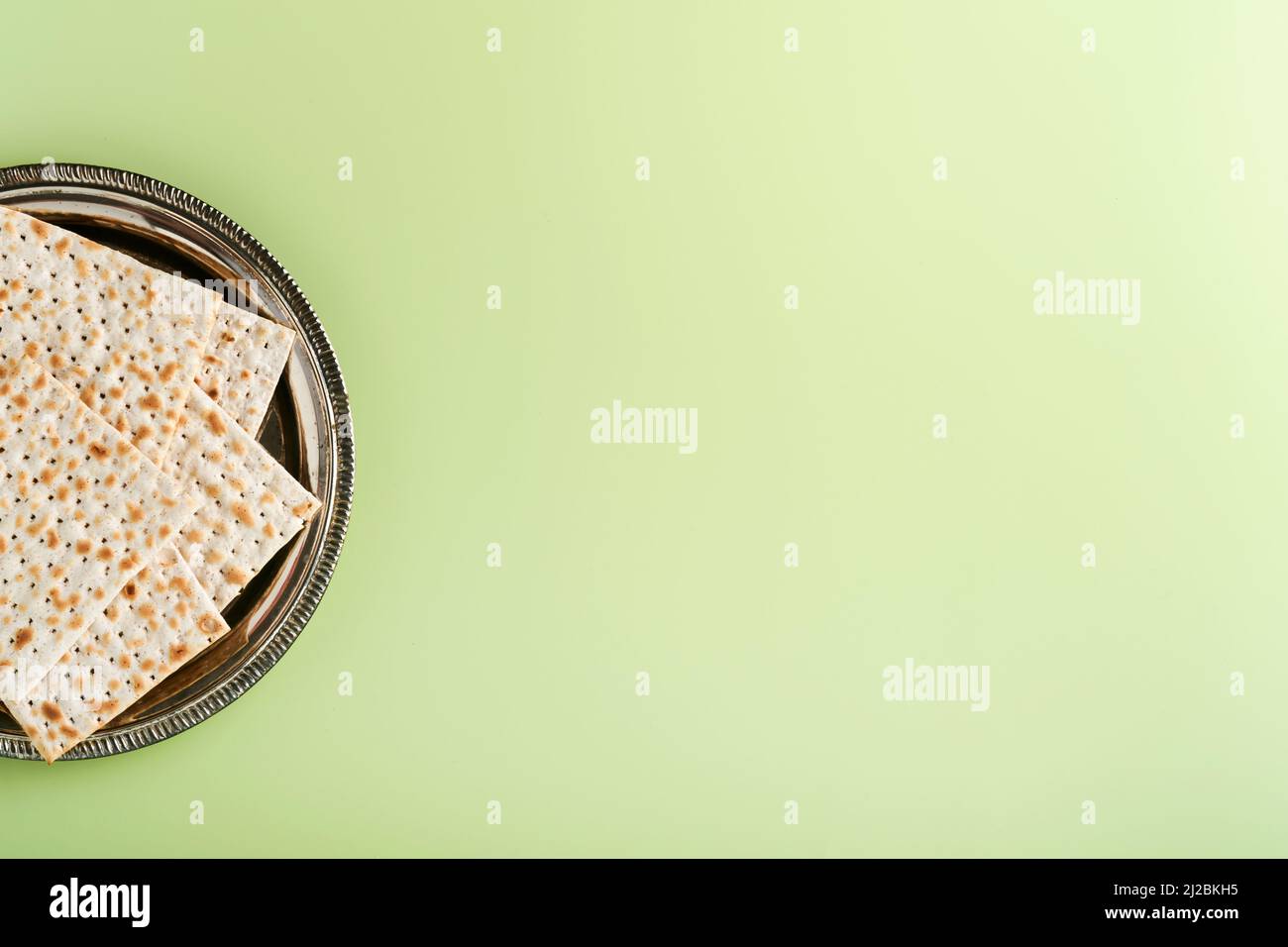 Passover celebration concept. Matzah, red kosher and walnut ...