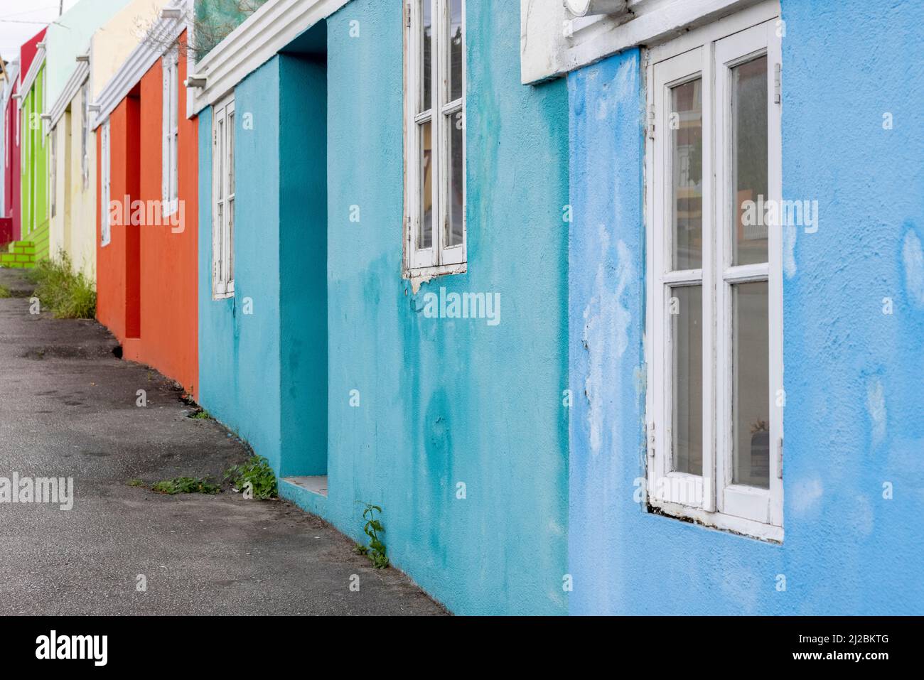 Small colorful houses along the road somewhere in Willemstad, Curacao ...