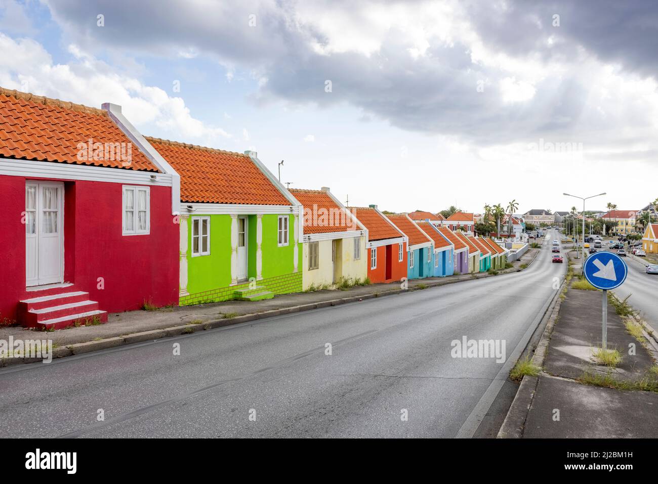 Small colorful houses along the road somewhere in Willemstad, Curacao ...