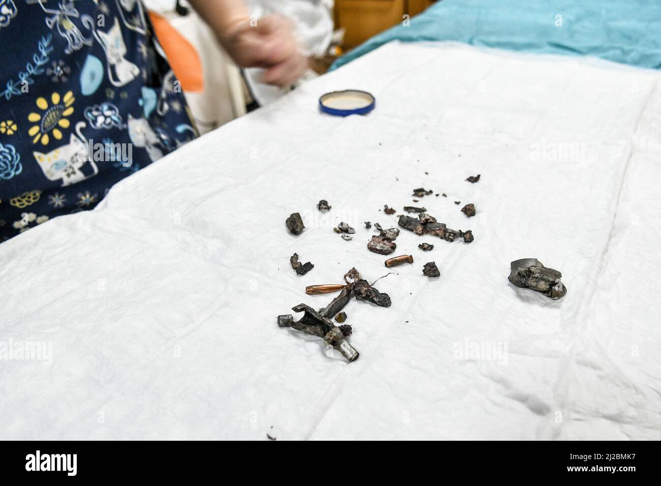 ZAPORIZHZHIA, UKRAINE - MARCH 29, 2022 - Shrapnel pieces lie on the ...