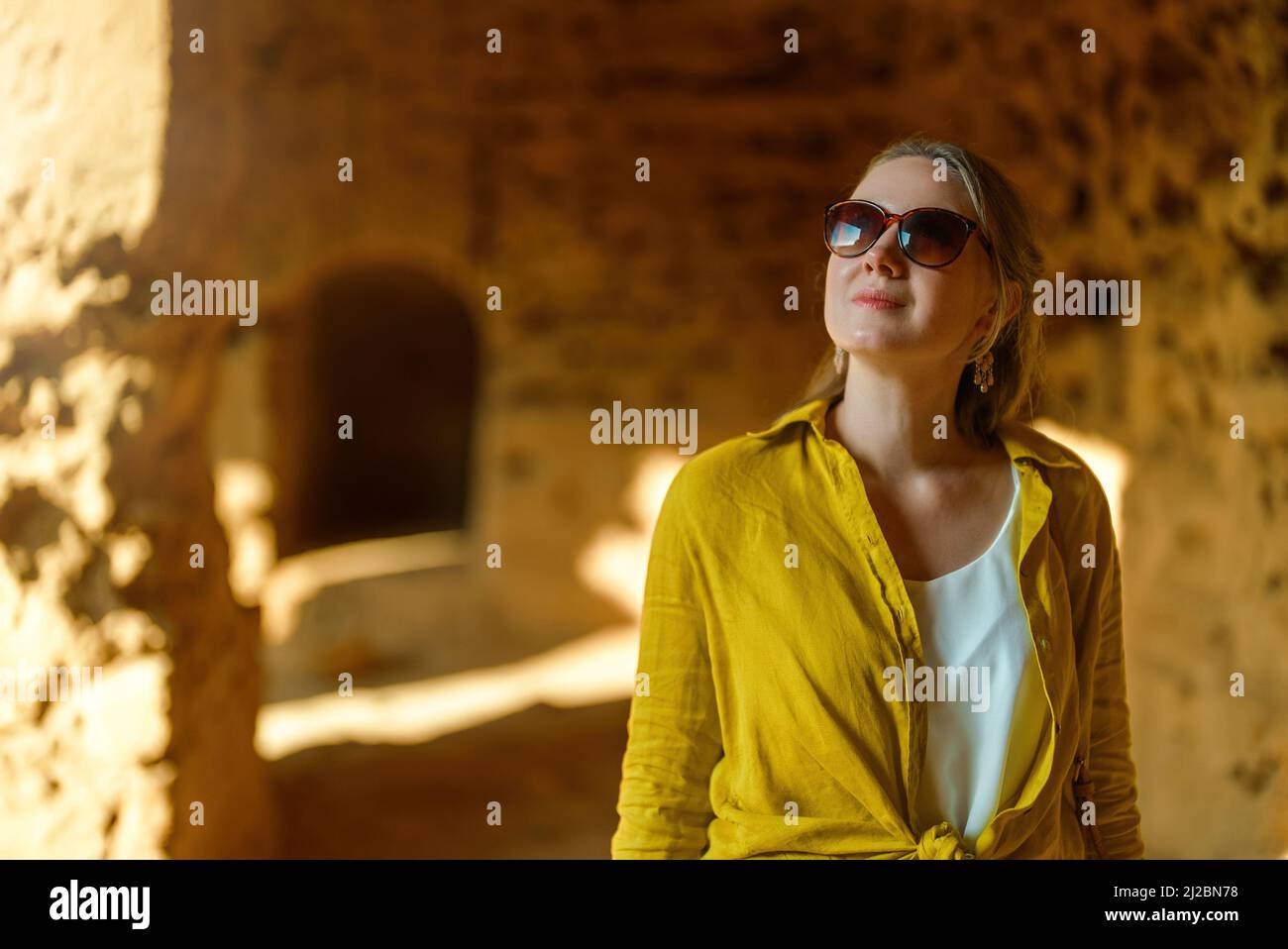 Woman visiting Tombs of the Kings in Paphos Stock Photo - Alamy