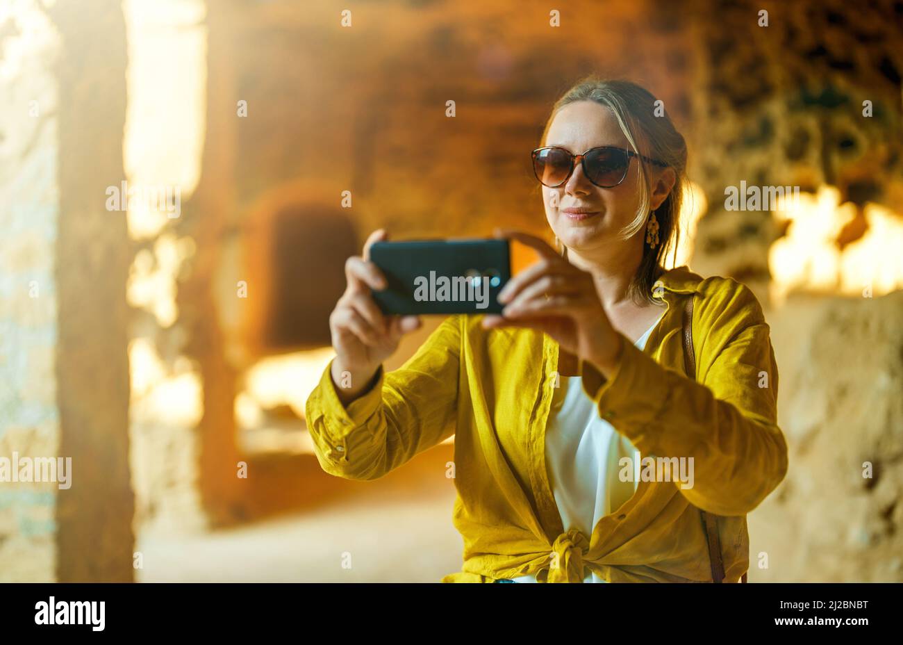 Woman visiting Tombs of the Kings in Paphos Stock Photo - Alamy
