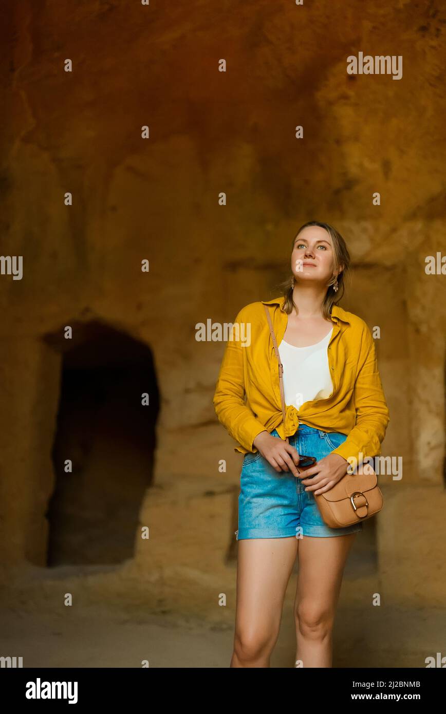 Woman visiting Tombs of the Kings in Paphos Stock Photo - Alamy