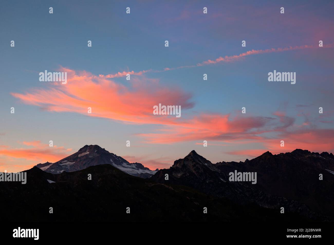 WA21225-00...WASHINGTON - Clouds at sunset over Glacier Peak from the ...