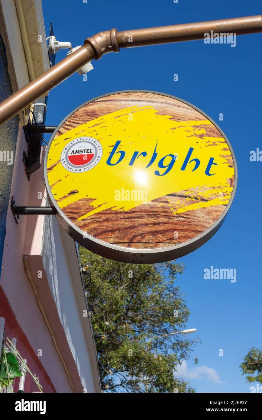 Sign of Amstel bright at a wall of a bar in Willemstad, Curacao Stock ...