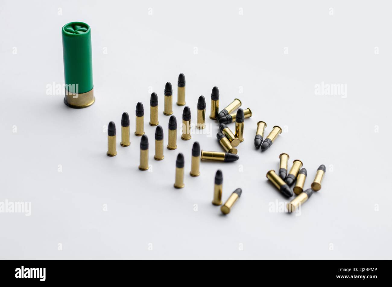 same caliber bullets near shotgun shell on white Stock Photo - Alamy