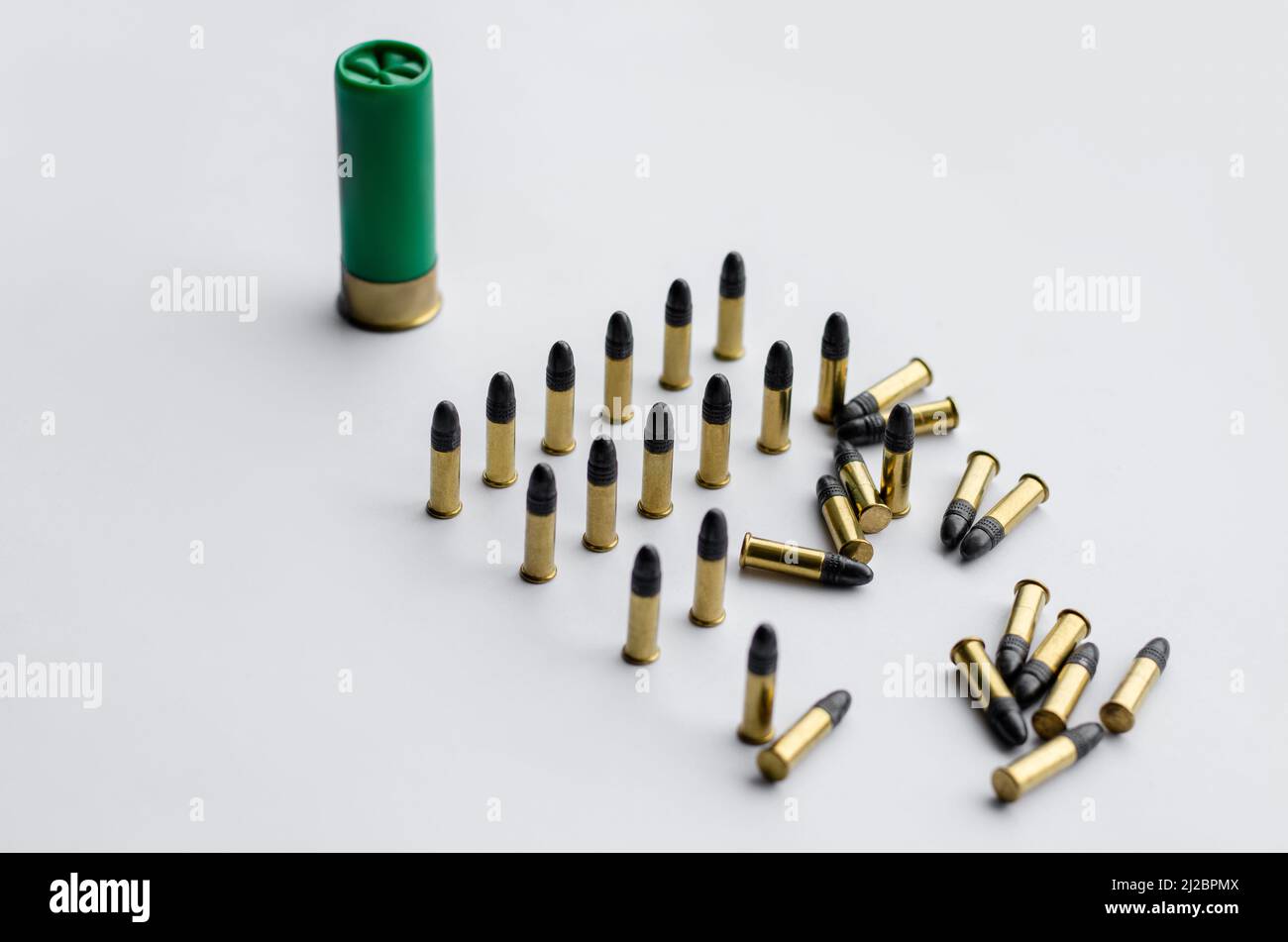 high angle view of bullets and shotgun shell on white background Stock ...