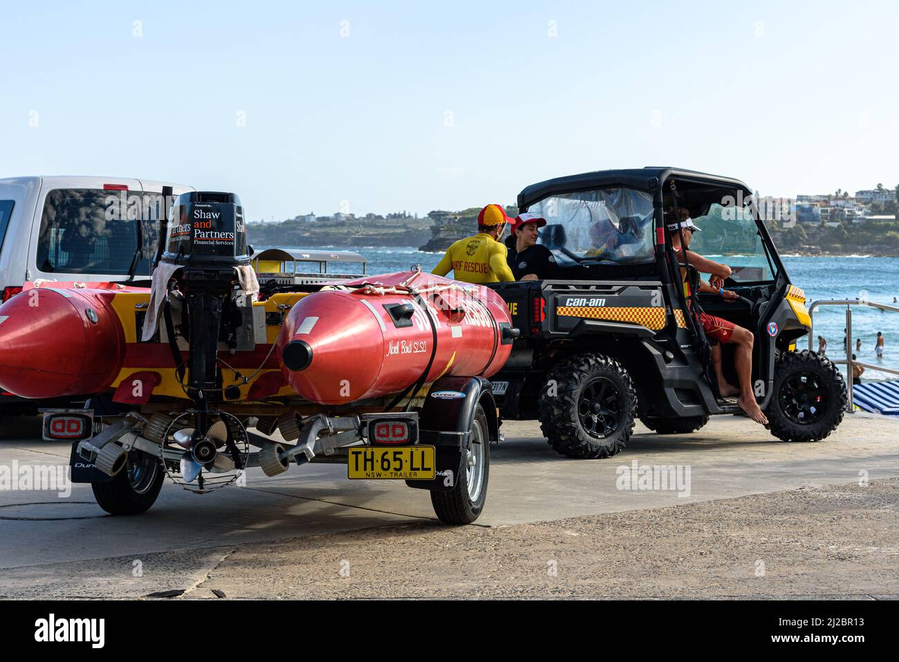 Surf Rescue transporting an inflatable boat to the water at Bondi Beach ...