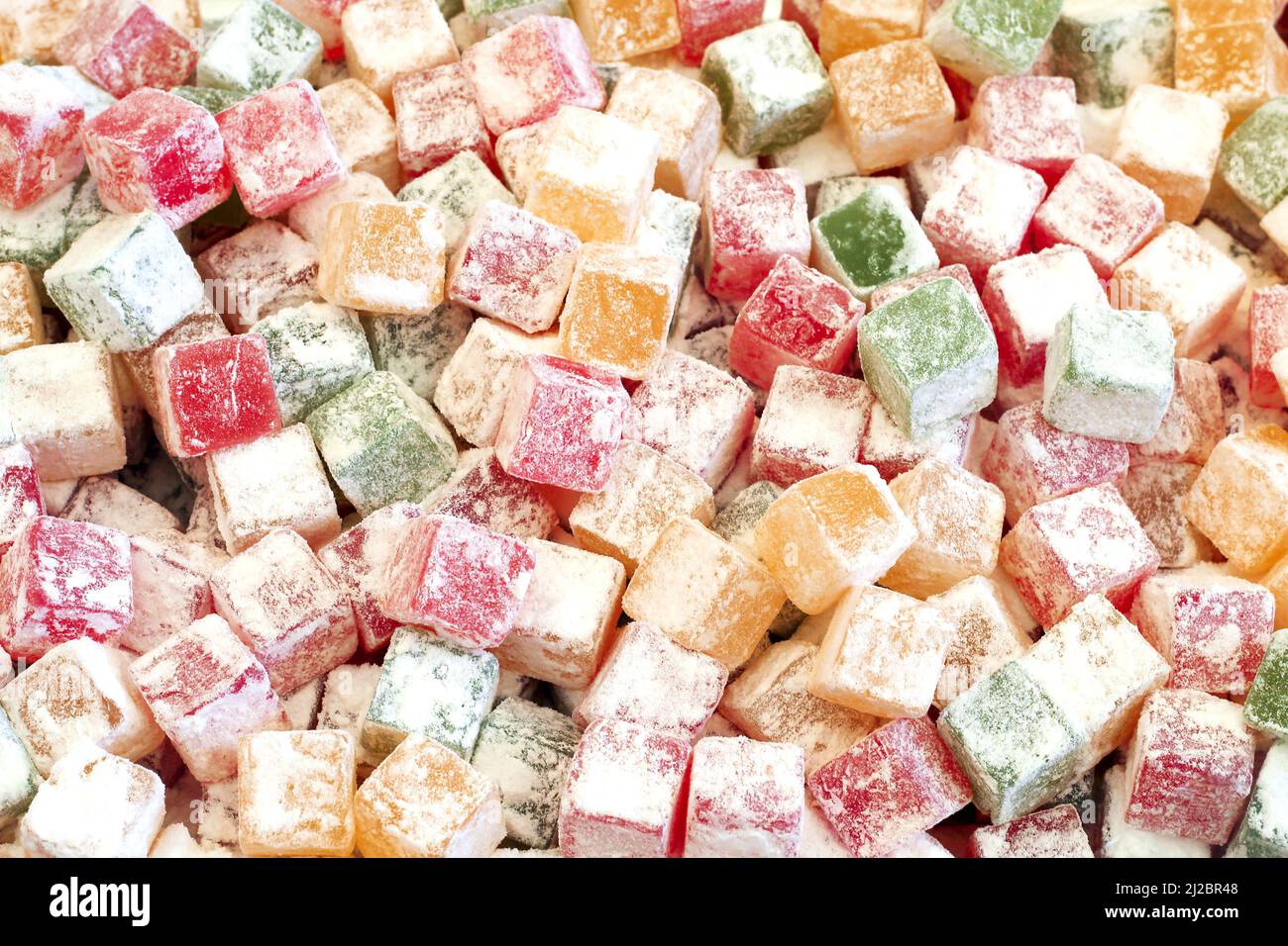 fruit paste sugar covered different colors candy background, top view ...