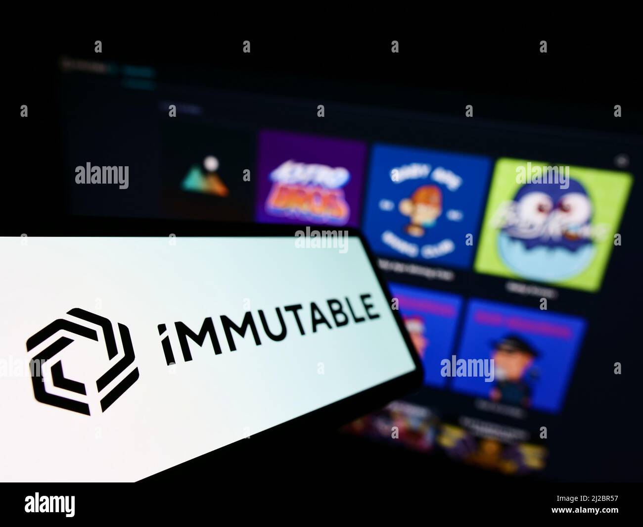 Smartphone with logo of Australian blockchain company Immutable Pty ...