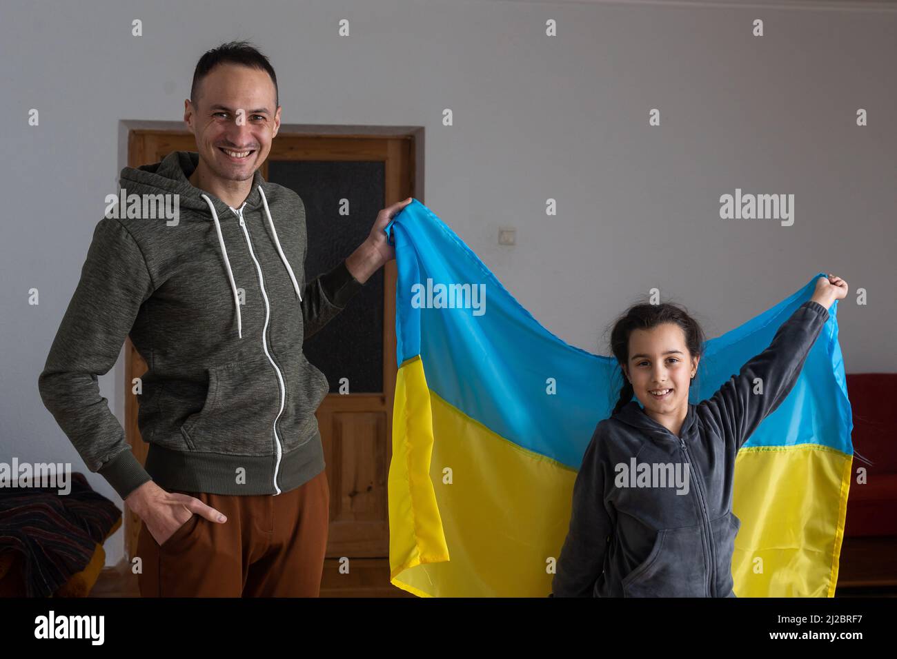 Ukrainian flag. Father with daughter at home Stock Photo - Alamy