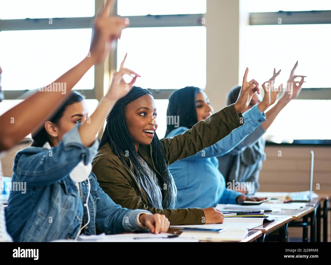 African american students hands raised hi-res stock photography and ...