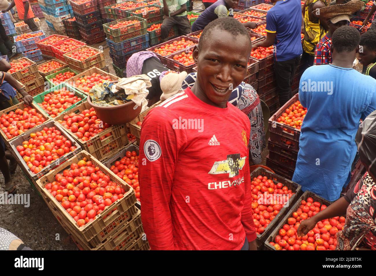 Nigerian people buying and selling tomatoes at the famous tomato market ...